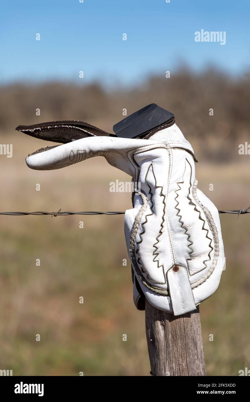 Cowboy boots on fence hi-res stock photography and images - Alamy