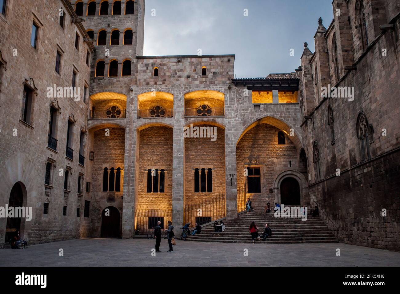 People hang out at medieval Plaza del Rei (King's Square) in Barcelona ...