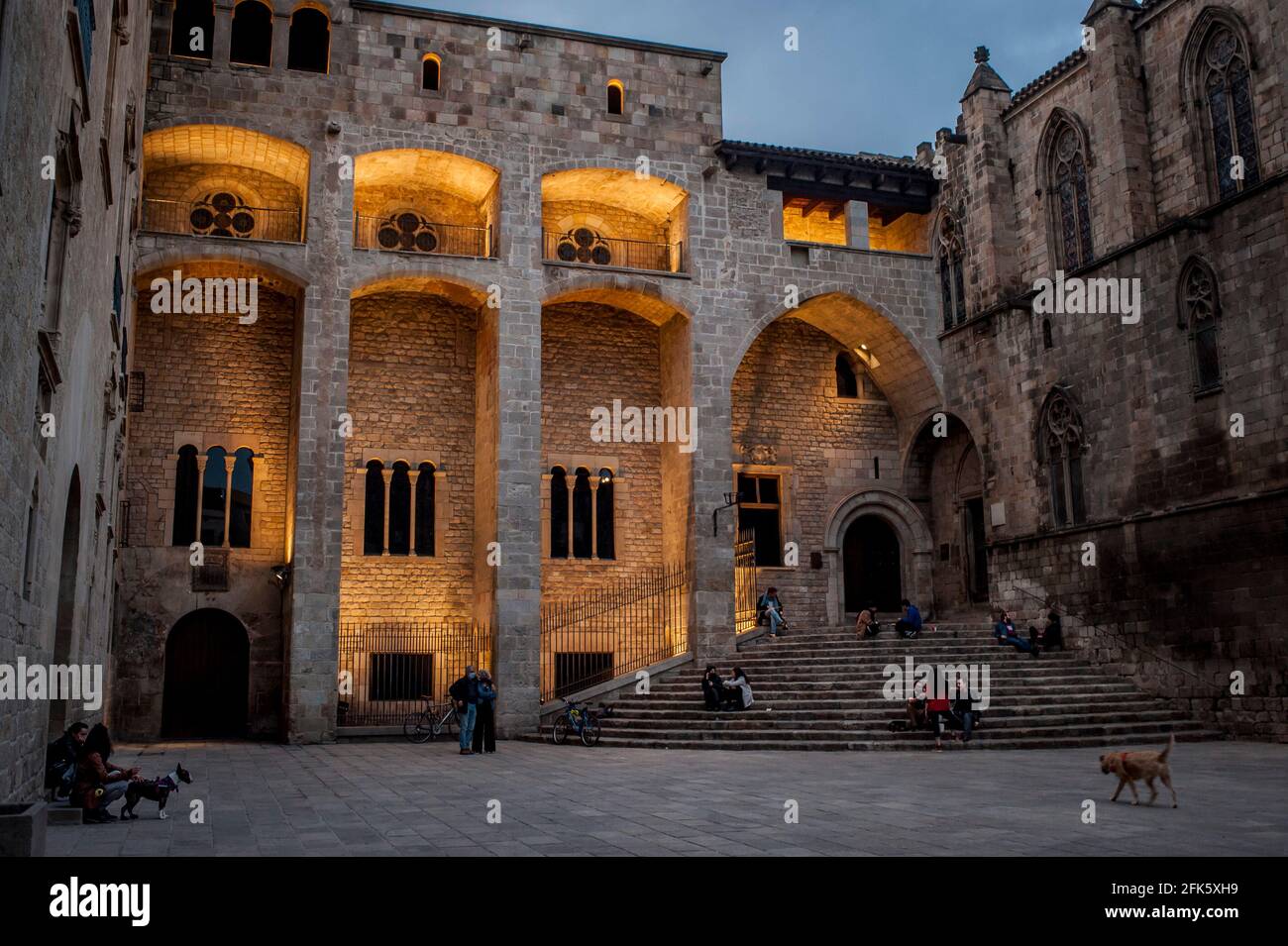 People hang out at medieval Plaza del Rei (King's Square) in Barcelona ...