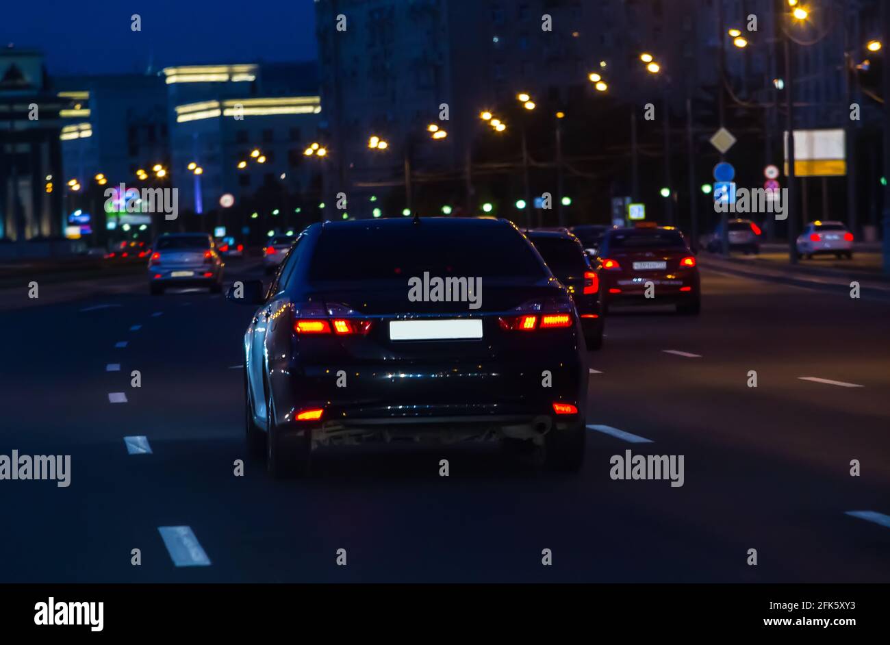 Car traffic at night on the avenue in the city Stock Photo - Alamy