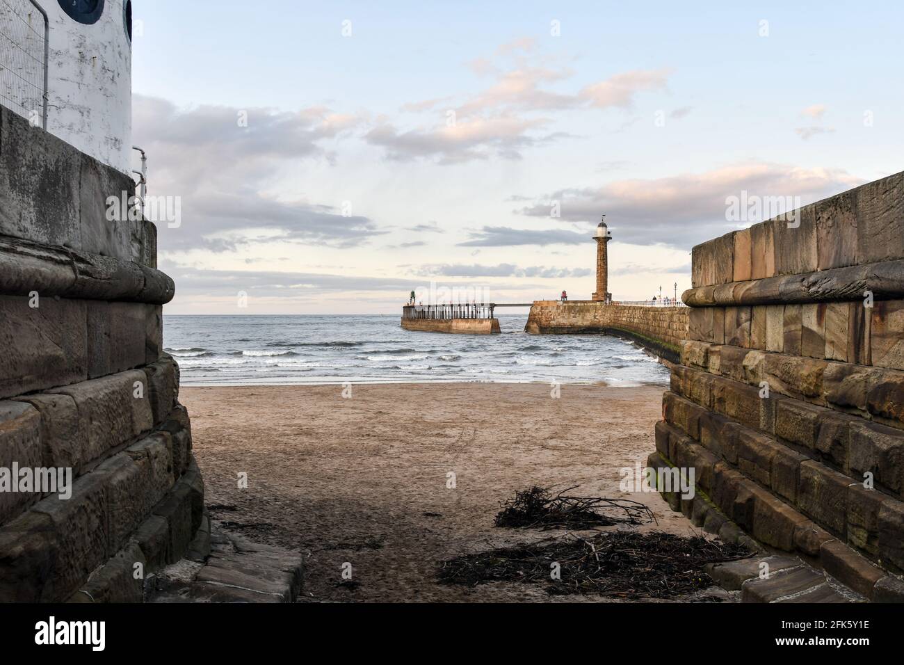 Whitby pier and lighthouse Stock Photo - Alamy