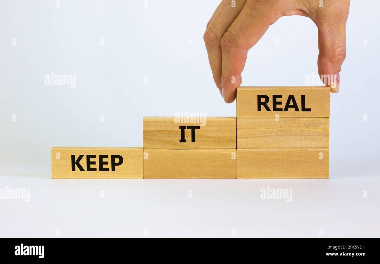 Keep it real symbol. Businessman placing a blocks with word 'keep' on ...