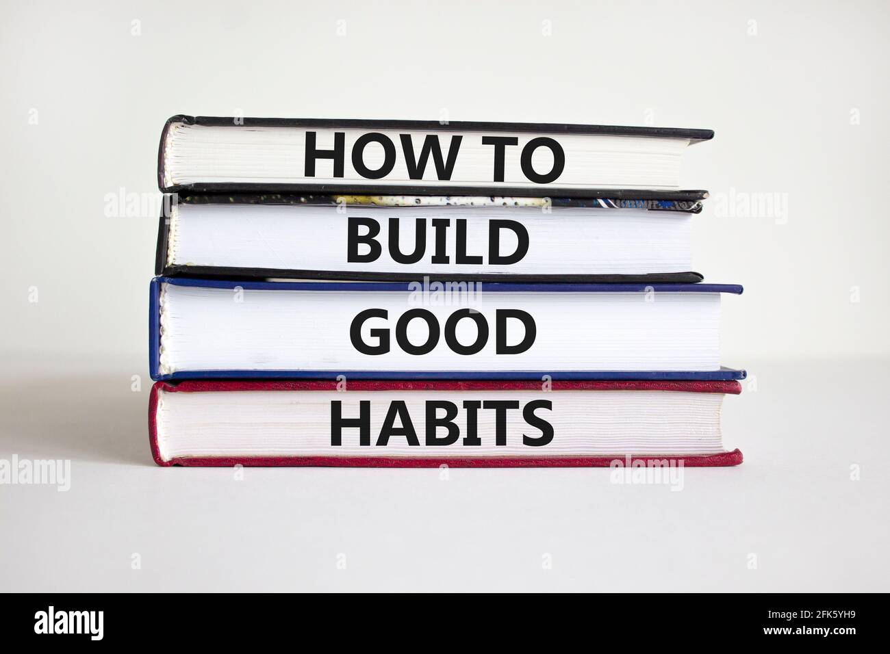 Build good habits symbol. Books with words 'How to build good habits ...