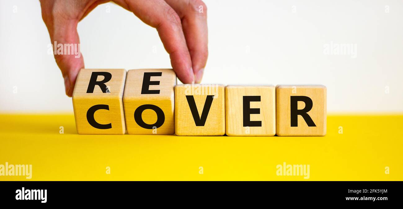 Recover symbol. Concept word 'recover' on wooden cubes on a beautiful ...