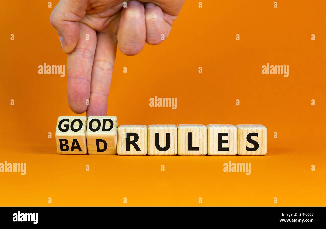Good or bad rules symbol. Businessman turns wooden cubes and changes ...