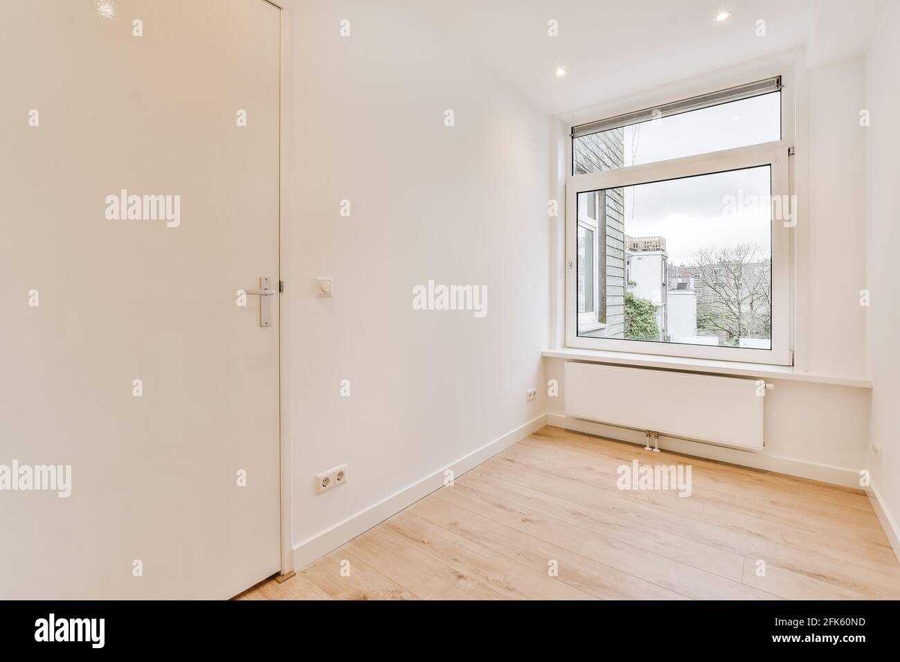 Spacious room in new flat designed in minimal style Stock Photo - Alamy