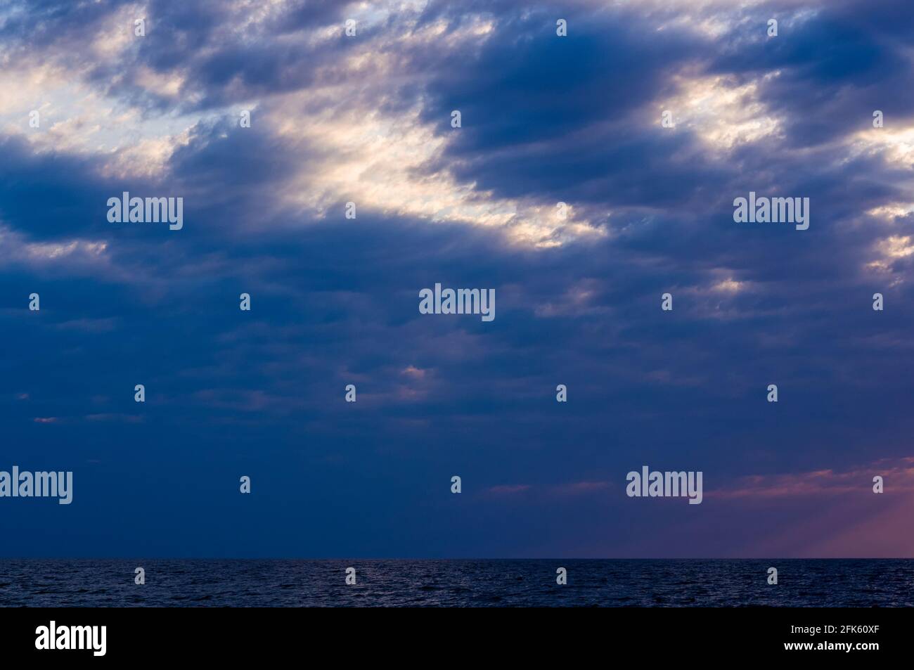 Amazing sea sunset, the sun, waves, clouds Stock Photo - Alamy