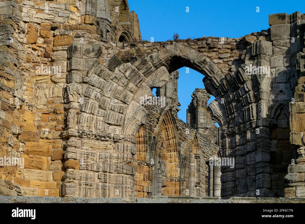 Stone arch of the gothic ruins of Whitby Abbey, Yorkshire, England ...