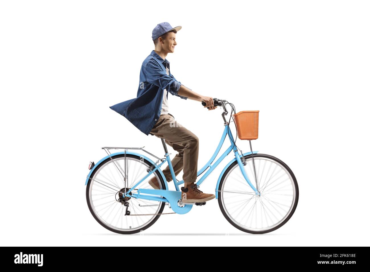 Full length profile shot of a casual guy riding a city bicycle isolated ...