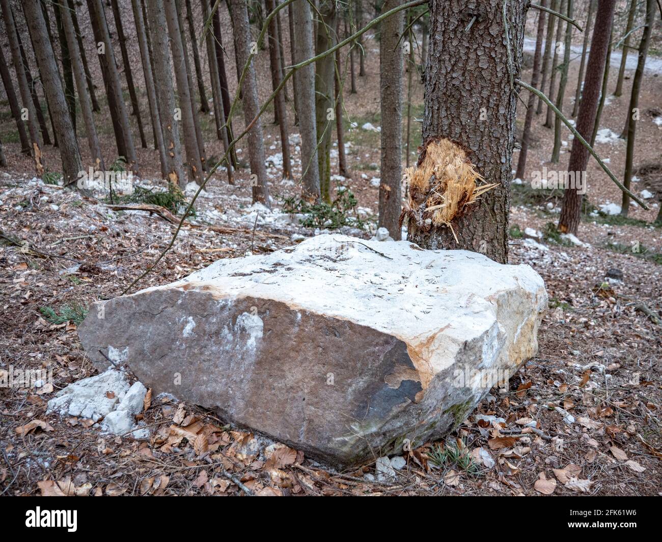 Collapsed rocky boulders fall down from sandstone rocks and landslide ...