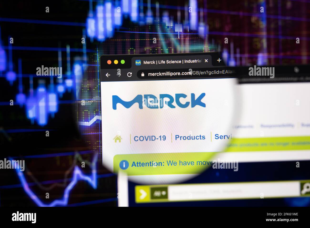 Merck company logo on a website with blurry stock market developments in the background, seen on ...