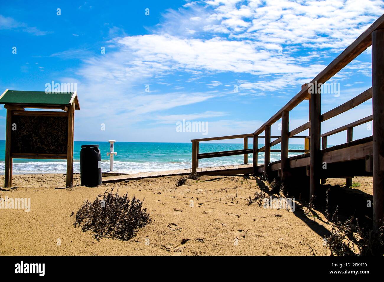 Wooden walkway to Arenales del Sol beach in a beautiful morning in ...