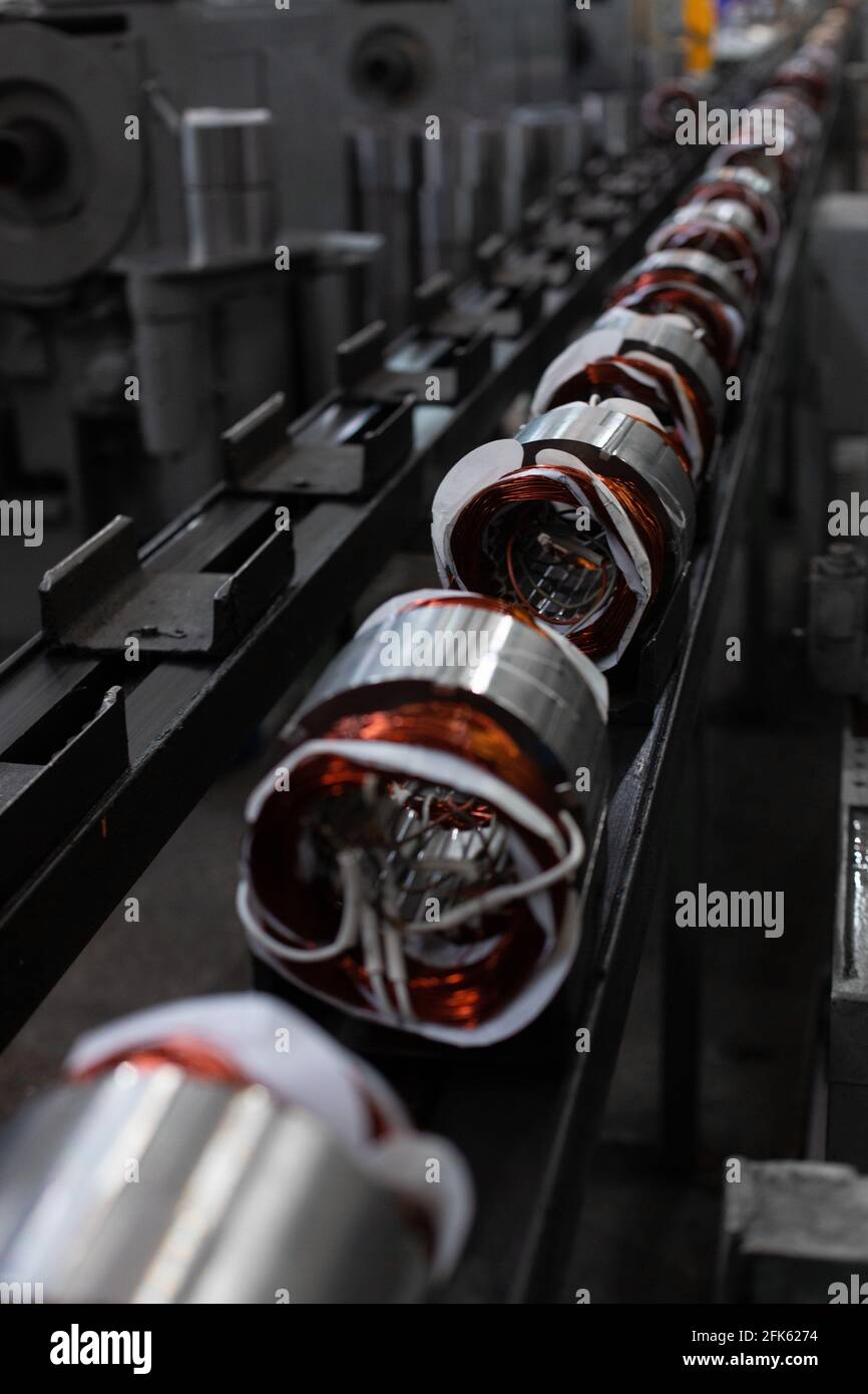 Long conveyor line for production of electric motors Stock Photo - Alamy