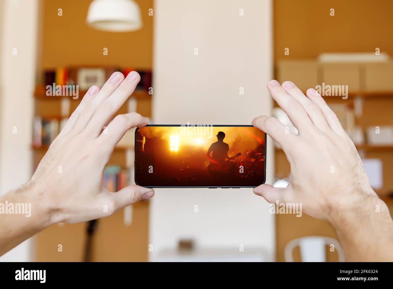 Mobile phone watching television hi-res stock photography and images ...