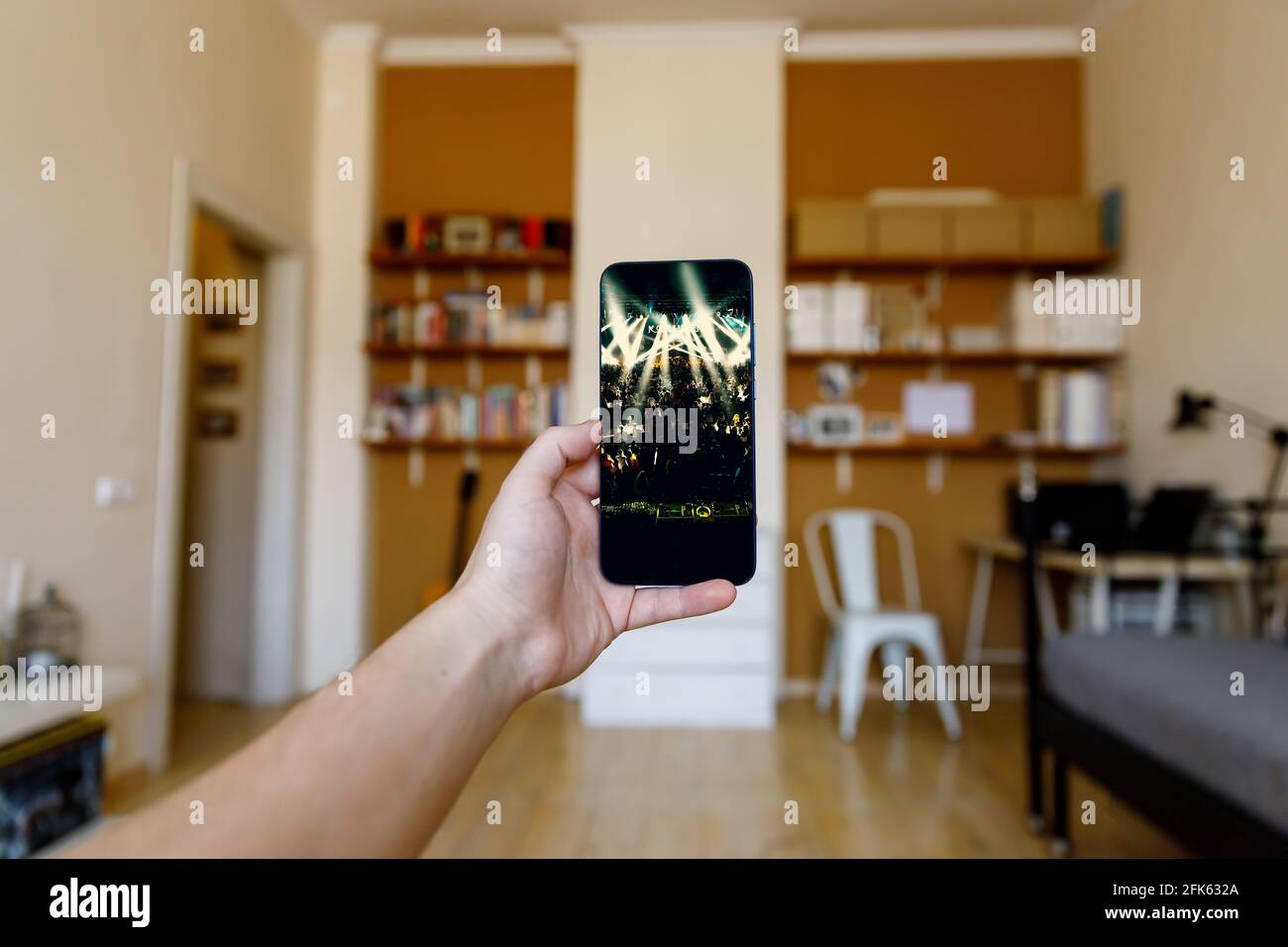 Concert festival show on the mobile phone screen at home Stock Photo ...