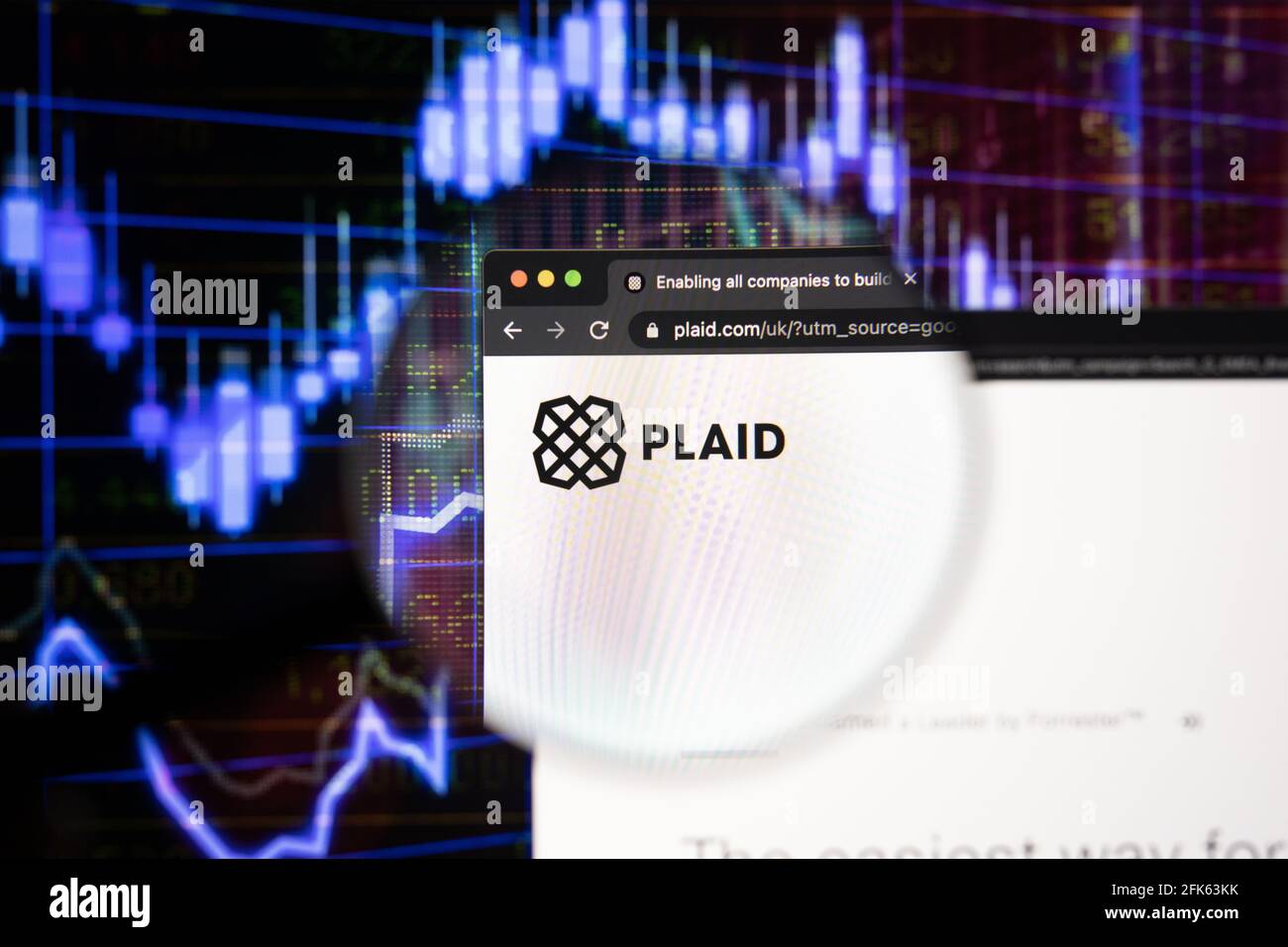 Plaid company logo on a website with blurry stock market developments ...