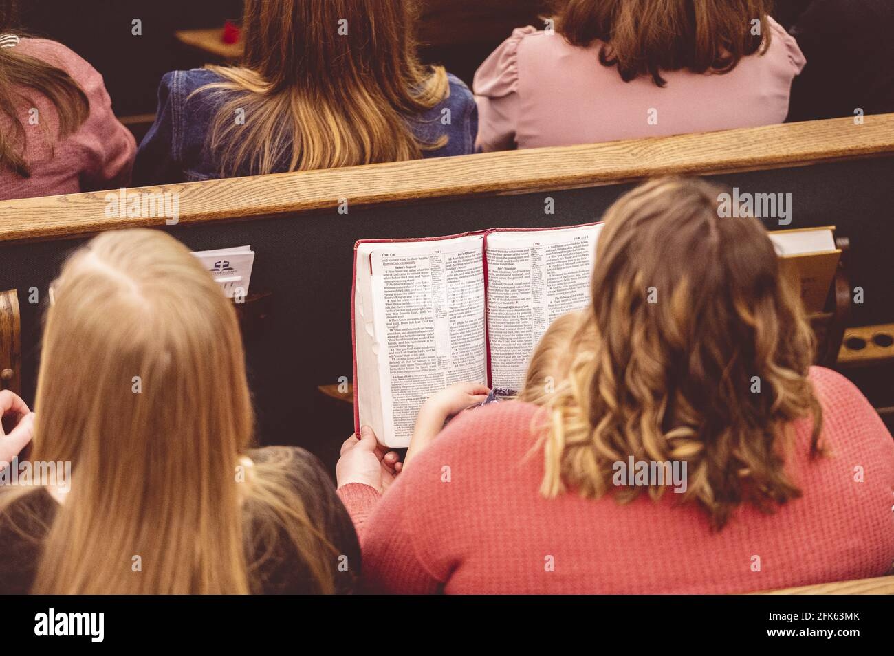 Group of people reading the bible in the church under the lights Stock ...