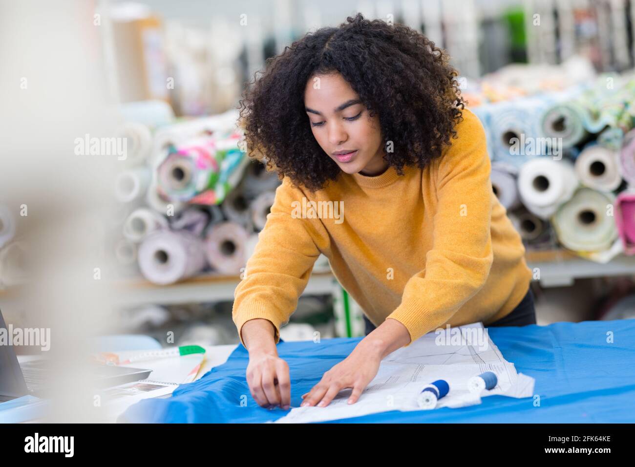 designer of clothes in studio Stock Photo - Alamy