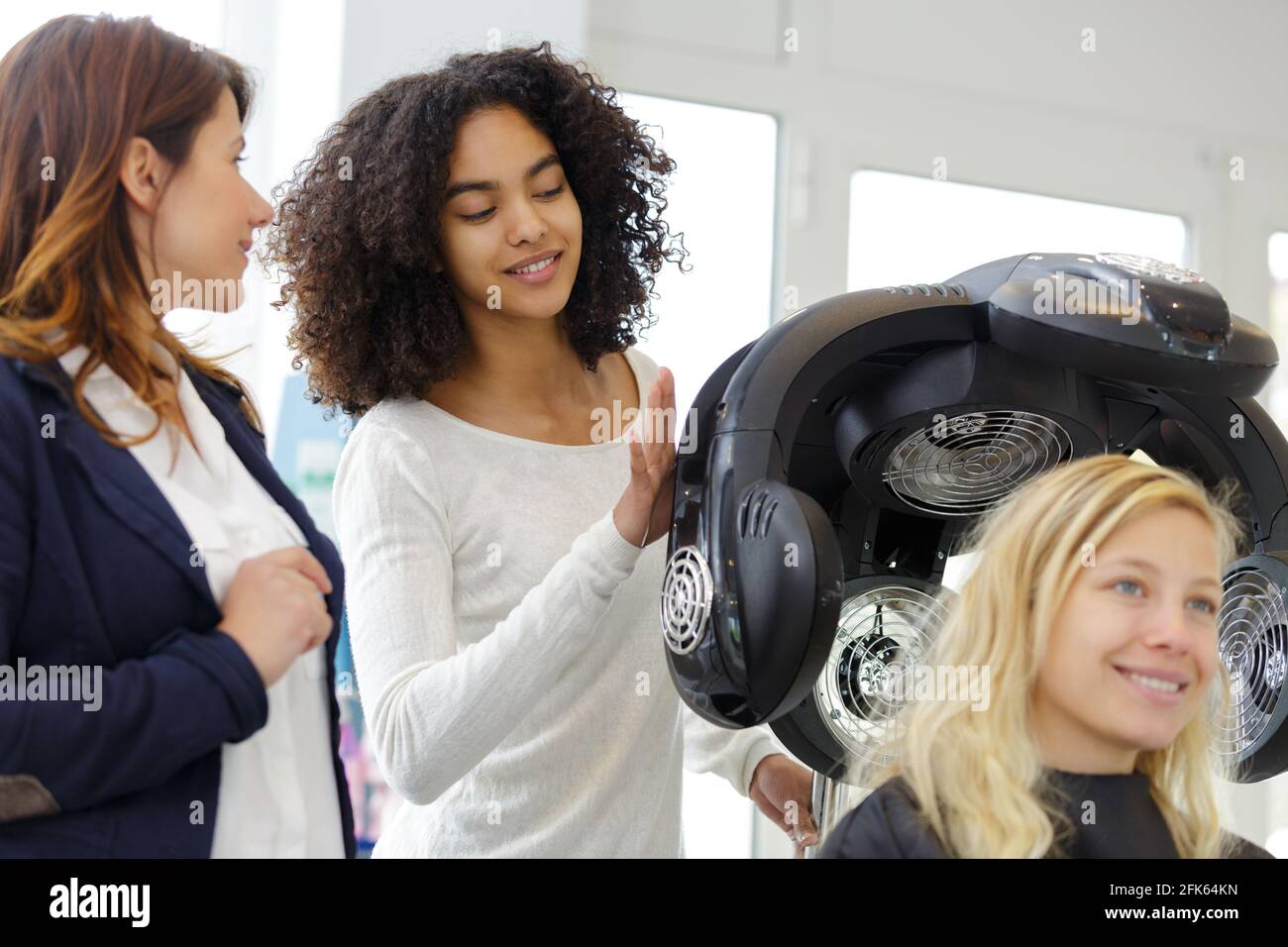 Hairdresser apprentice hi-res stock photography and images - Alamy