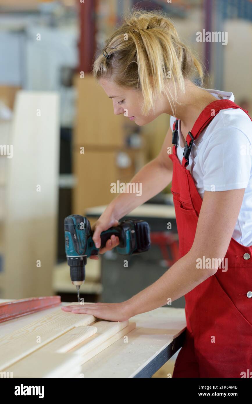 Woman toolbox at home drill hi-res stock photography and images - Alamy