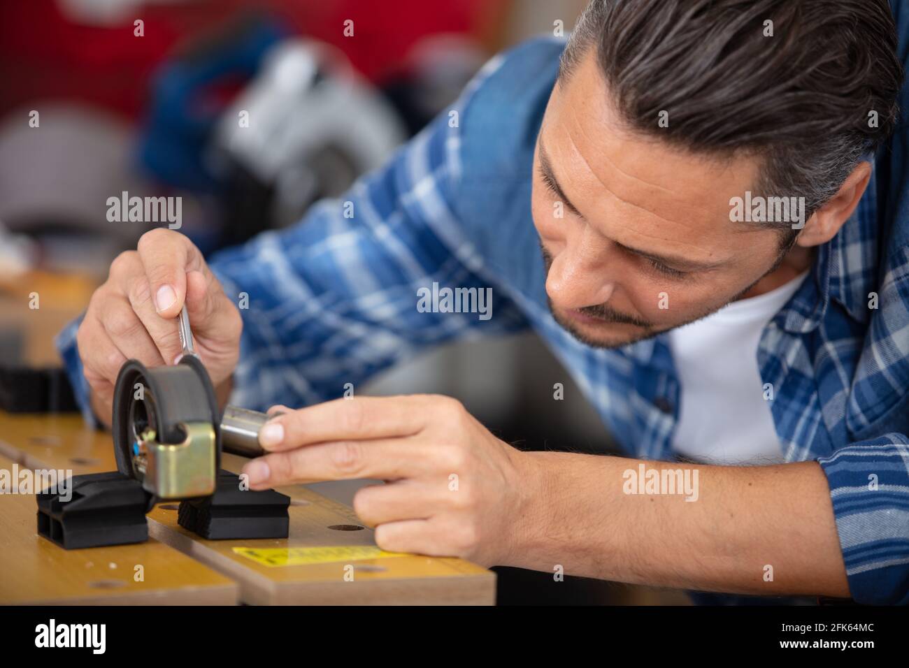 close-up carpenter process of wood door hinge installation Stock Photo ...