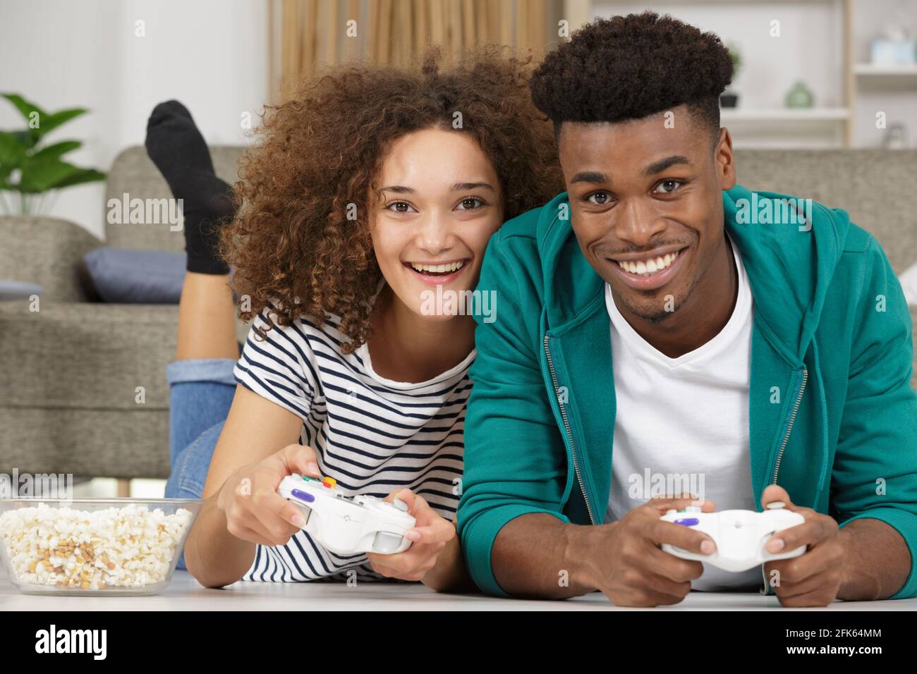 Cute couple playing video games hi-res stock photography and images - Alamy