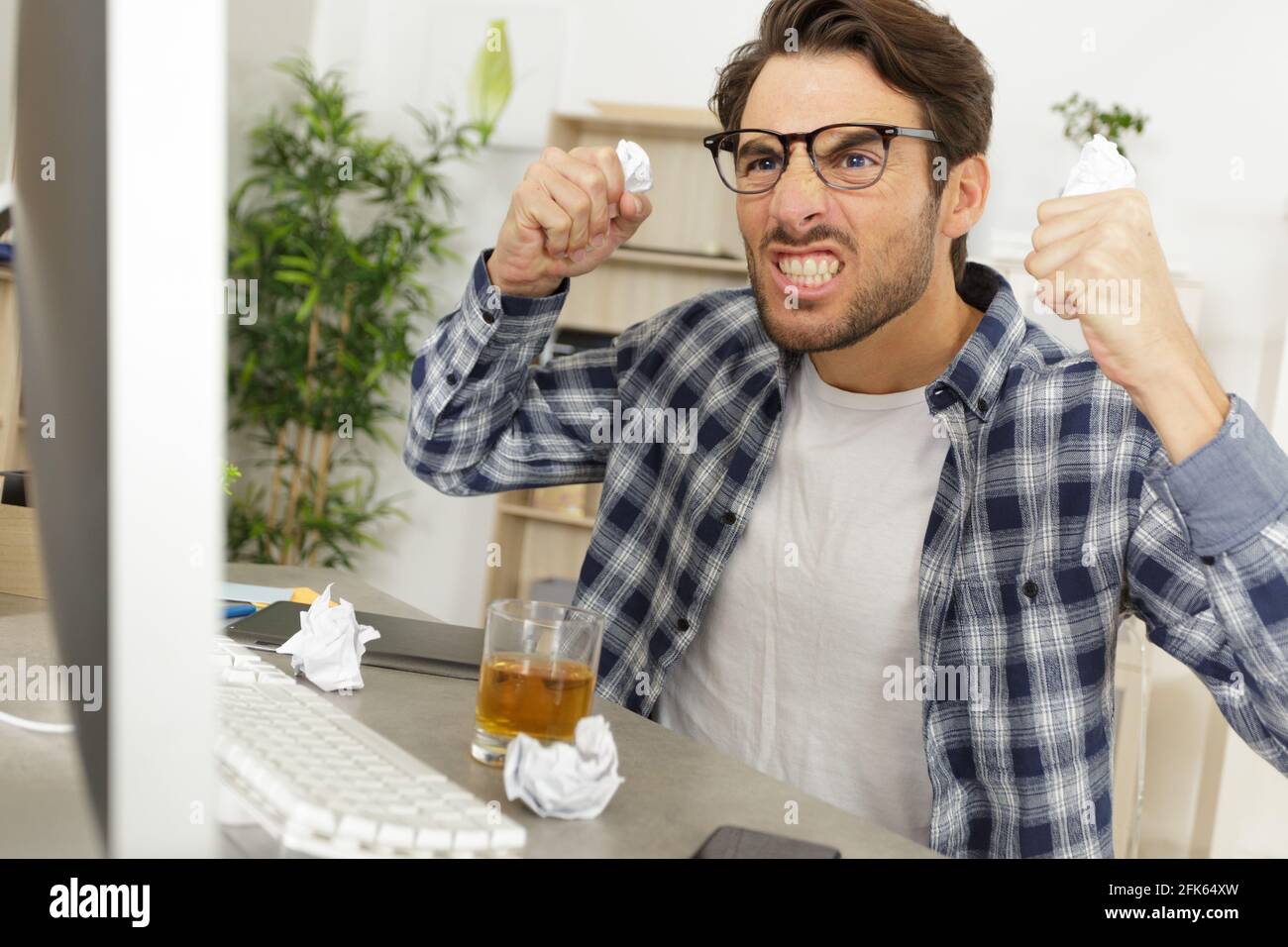 angry and upset man drinking alcohol Stock Photo - Alamy