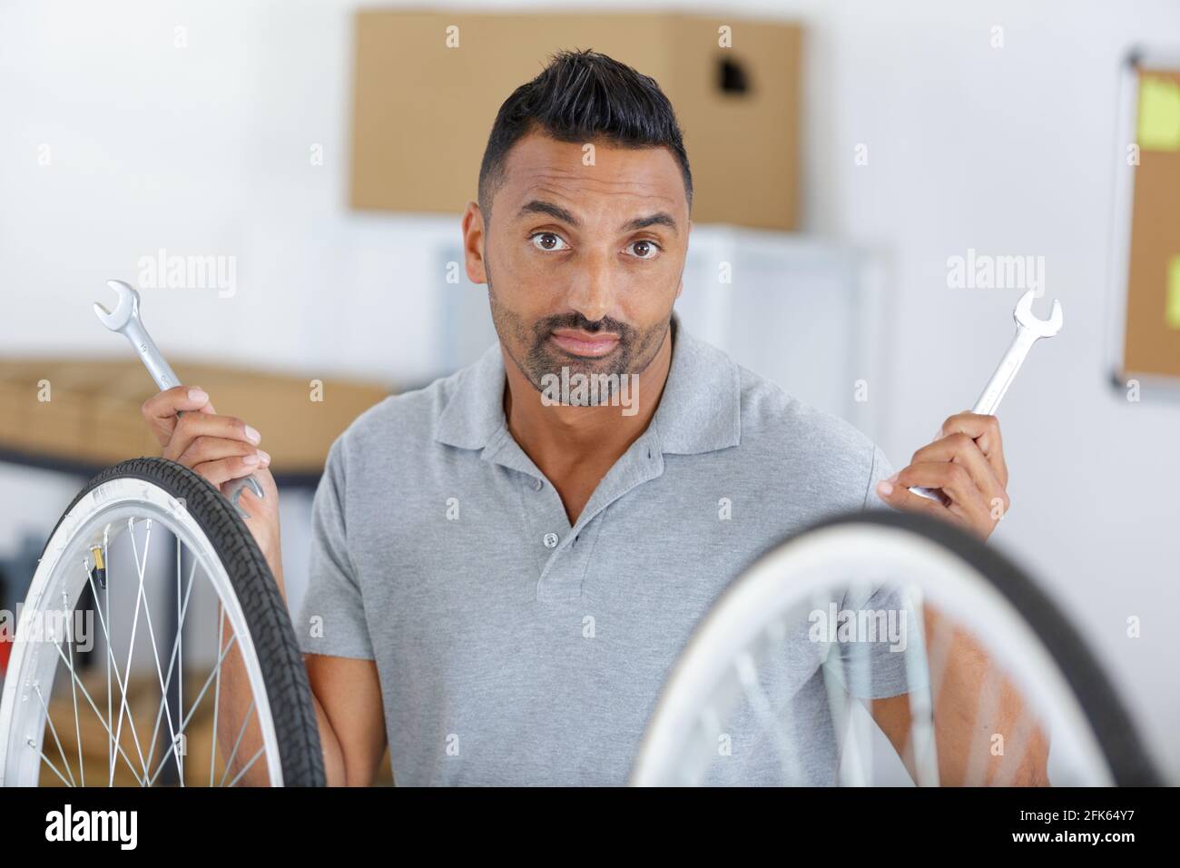 man learning how to repair bicycle Stock Photo - Alamy