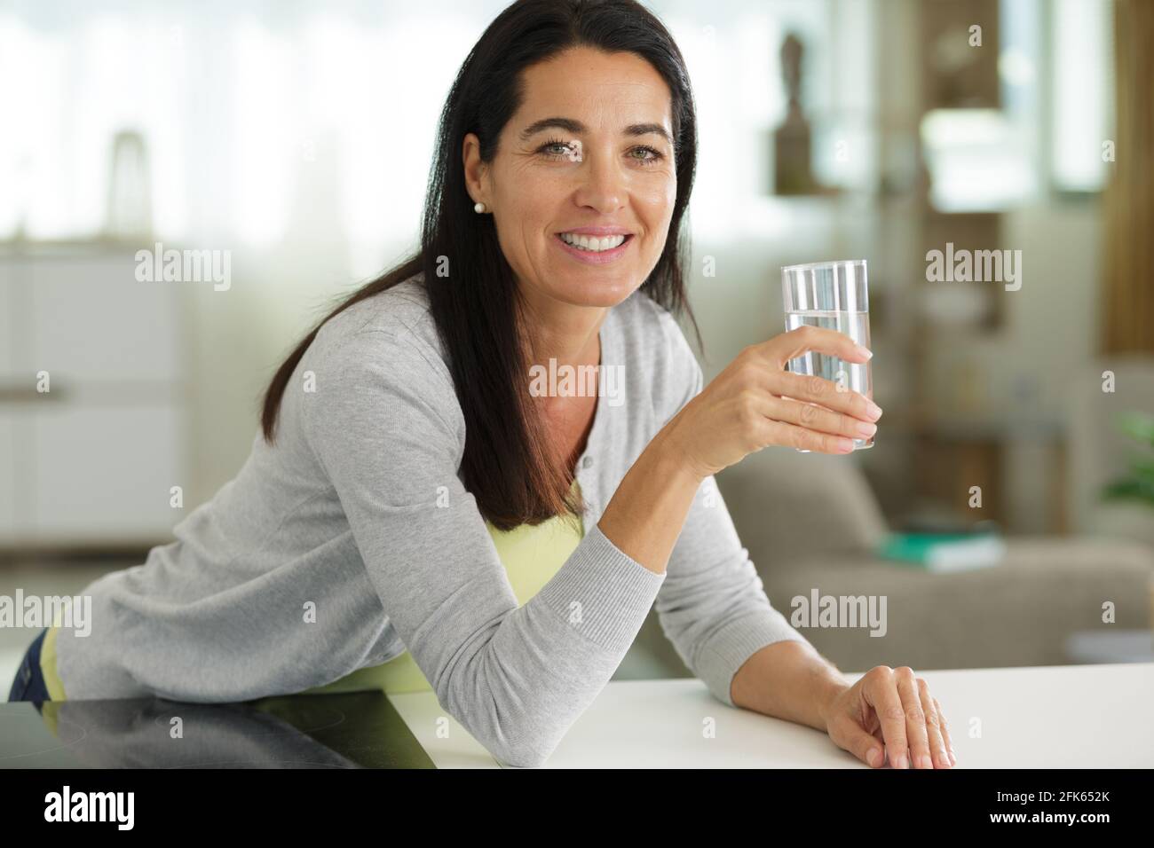 Female 40s drinking glass water hi-res stock photography and images - Alamy