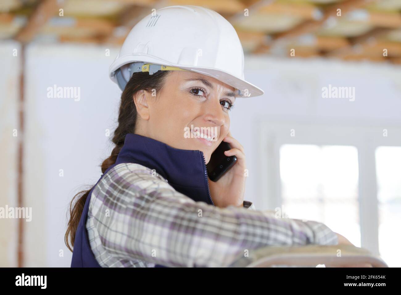 attractive boss woman builder in an helmet Stock Photo - Alamy