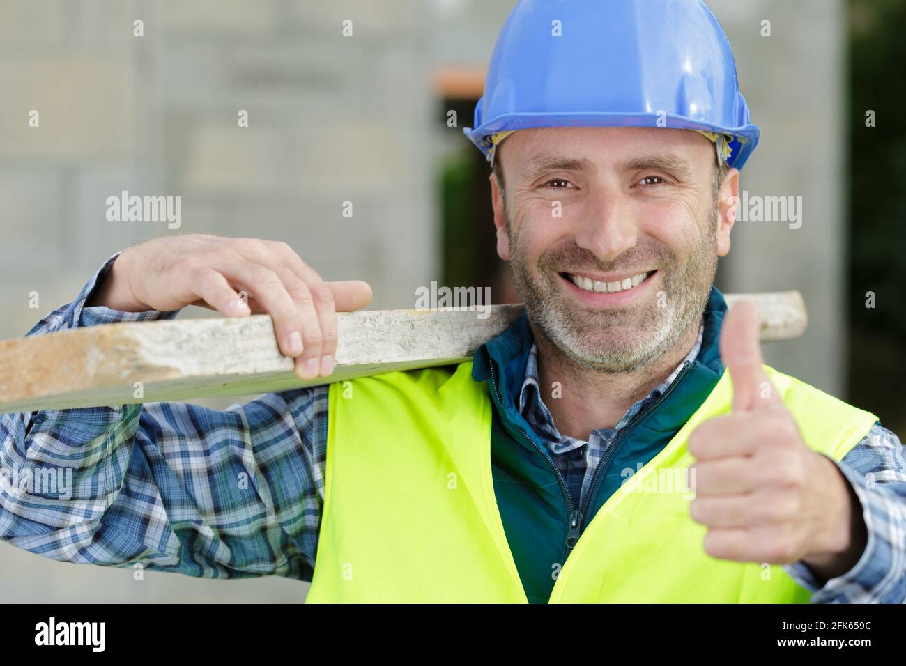 happy builder showing thumb up Stock Photo - Alamy