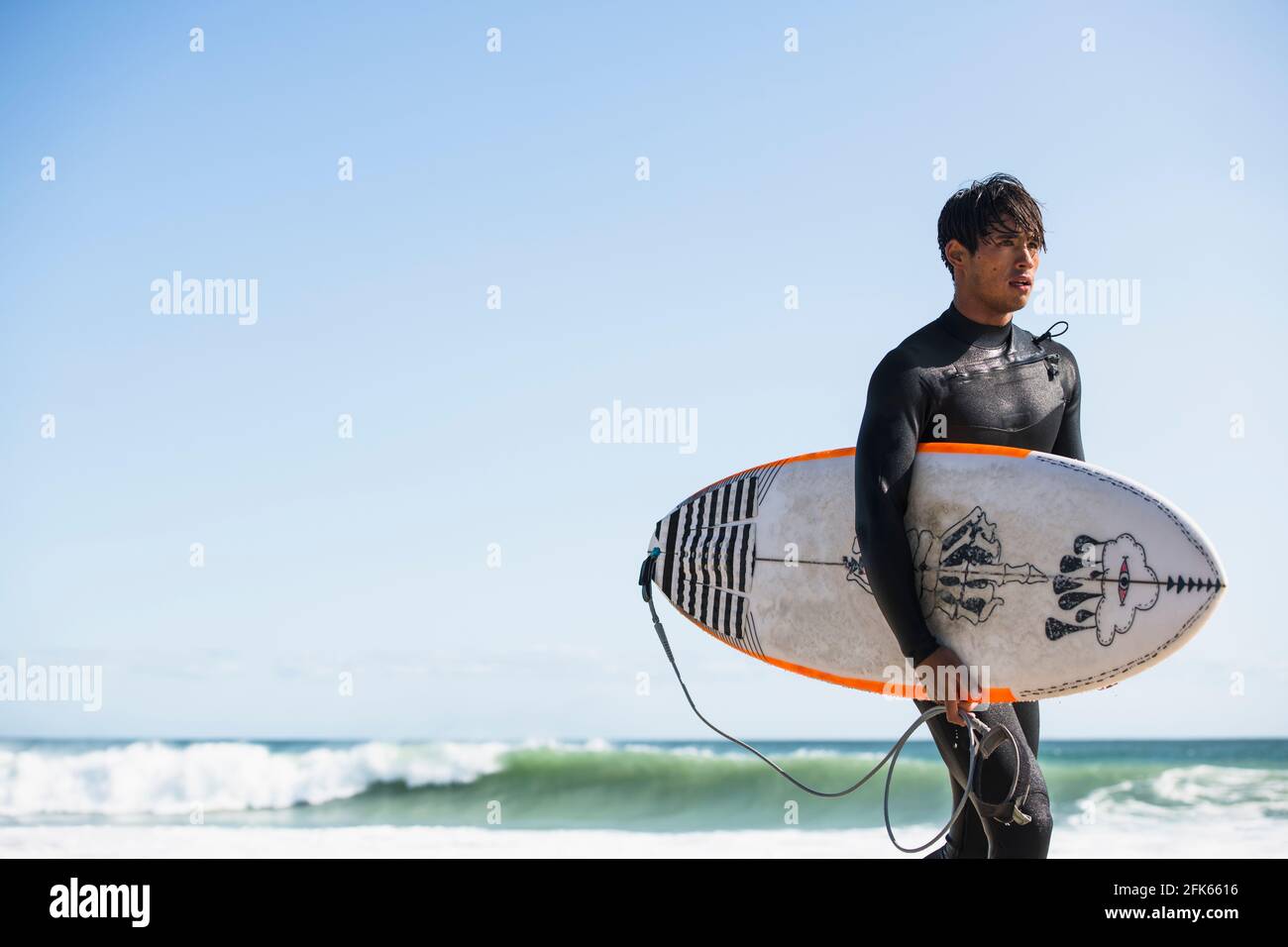 Young Asian Man on the beach after summer surf Stock Photo - Alamy