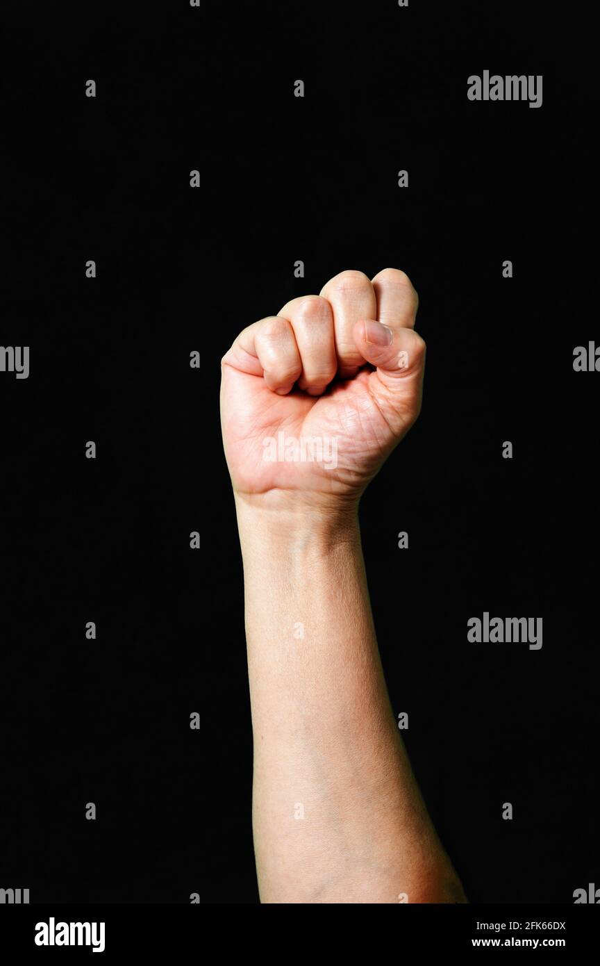 Raised fist symbol of fist empowerment Stock Photo - Alamy