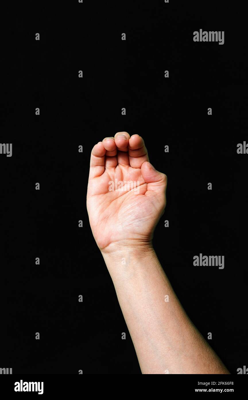 Letter C International sign language dark background Stock Photo - Alamy