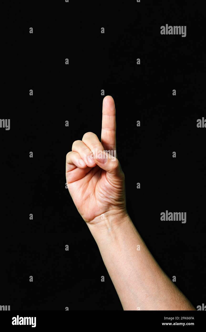 Letter D International sign language dark background Stock Photo - Alamy