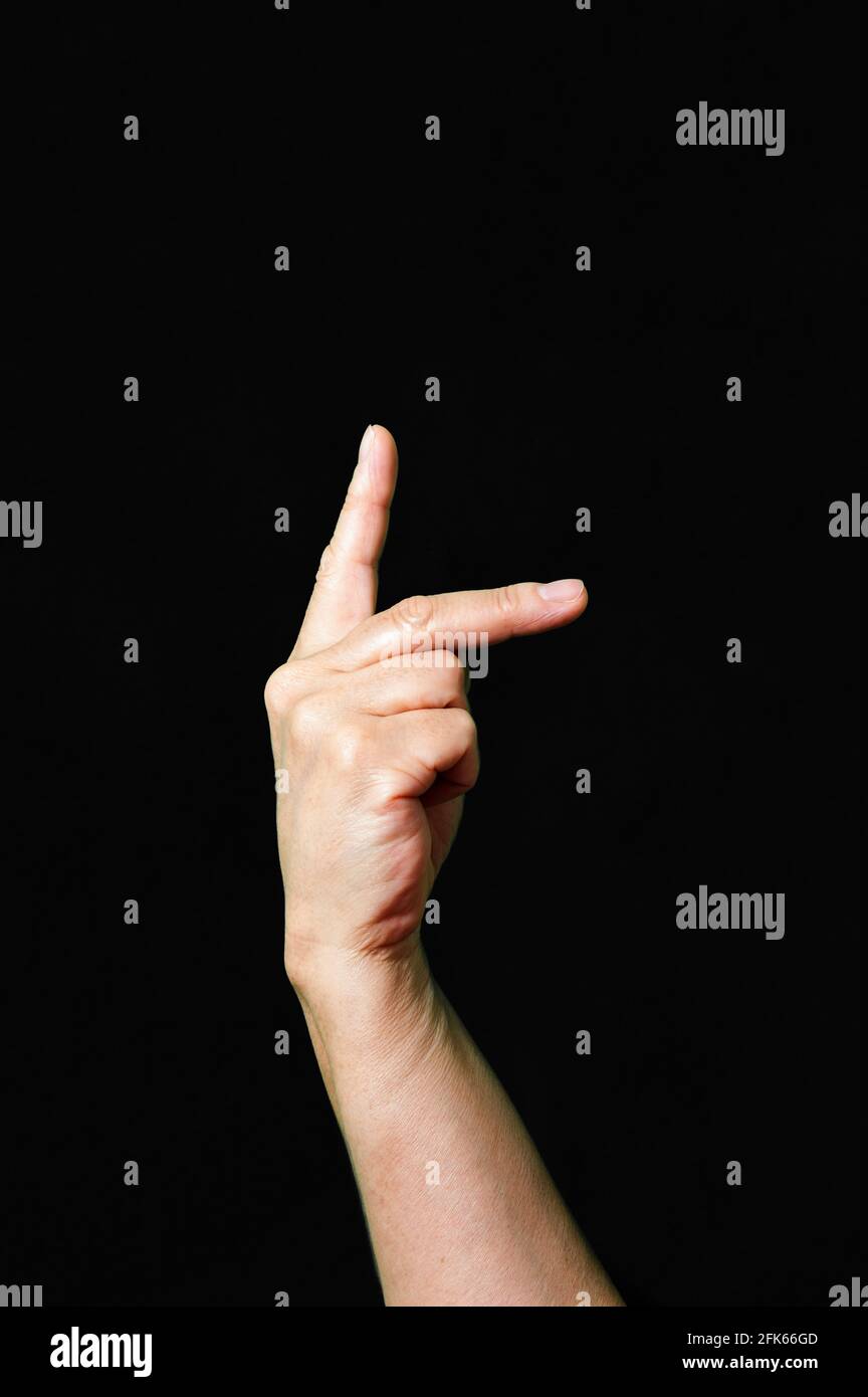 Letter K International sign language dark background Stock Photo - Alamy