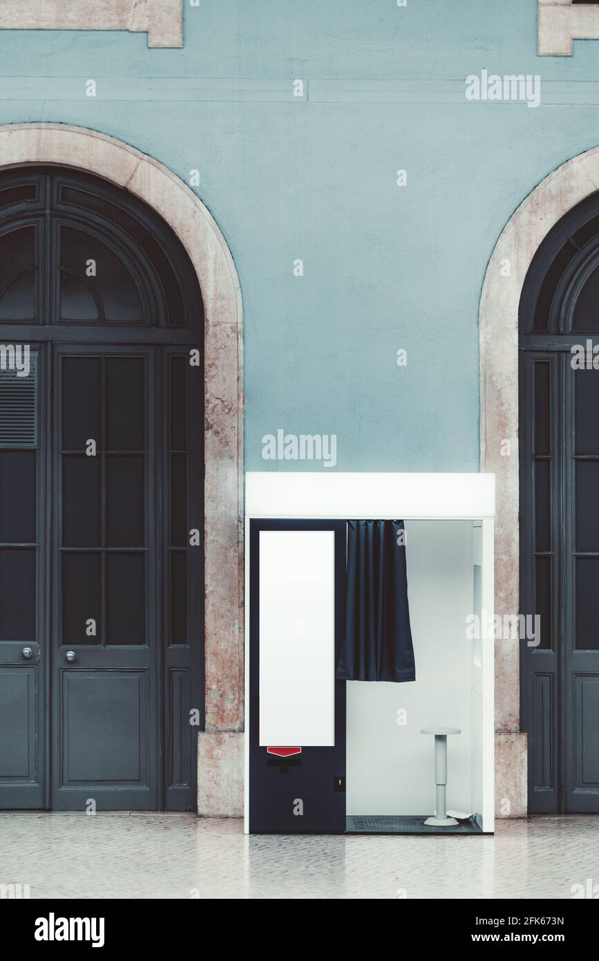 Vertical shot of an indoor empty photo booth with open curtain, in ...