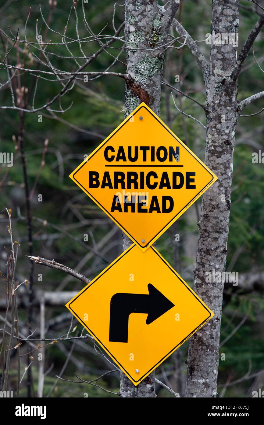 Warning caution sign on a snowmobile trail in the Adirondack Mountains ...