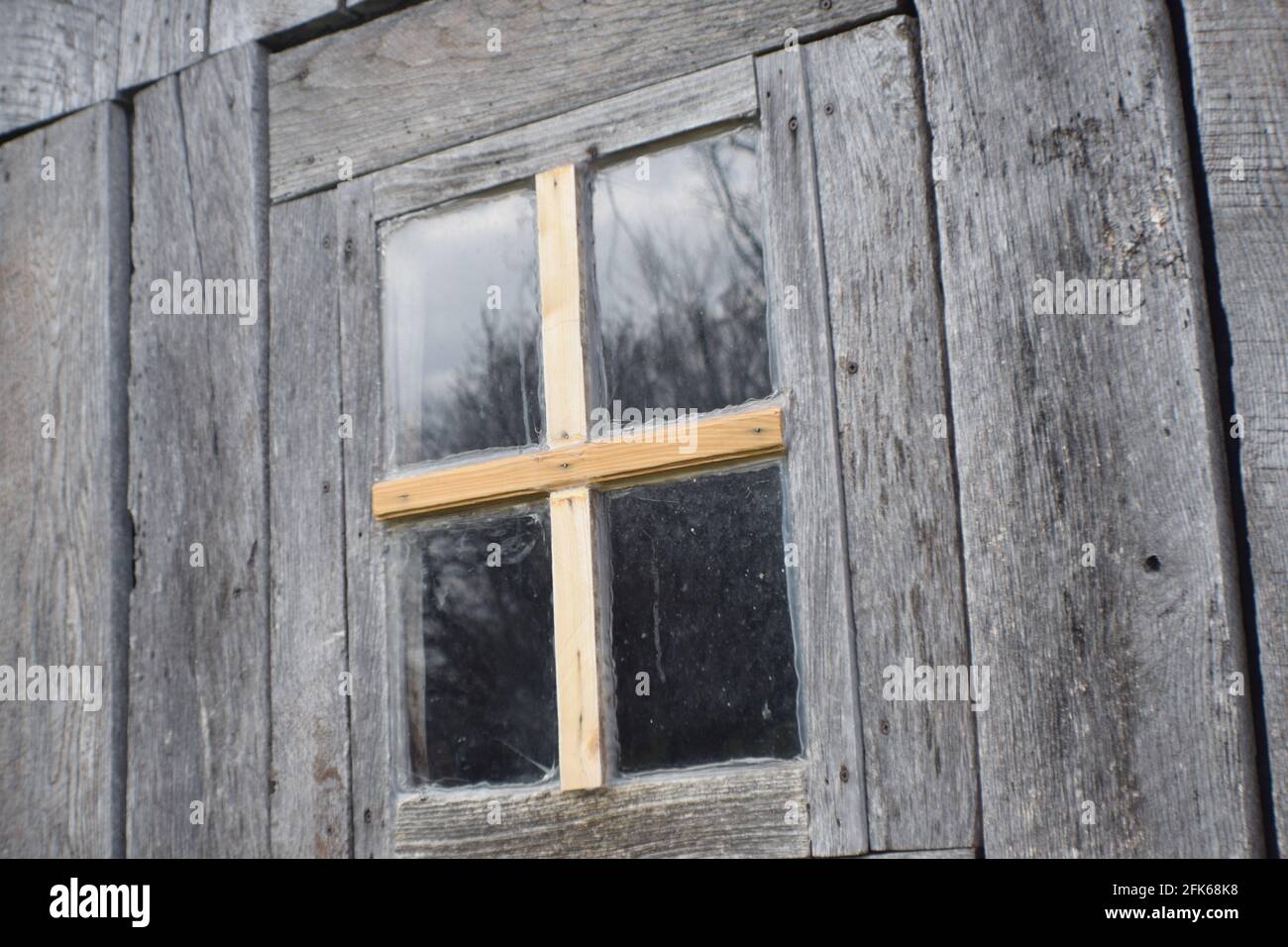 Cross in window Stock Photo - Alamy
