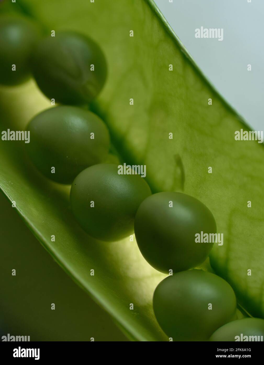 Closeup of peas in a pea pod Stock Photo - Alamy