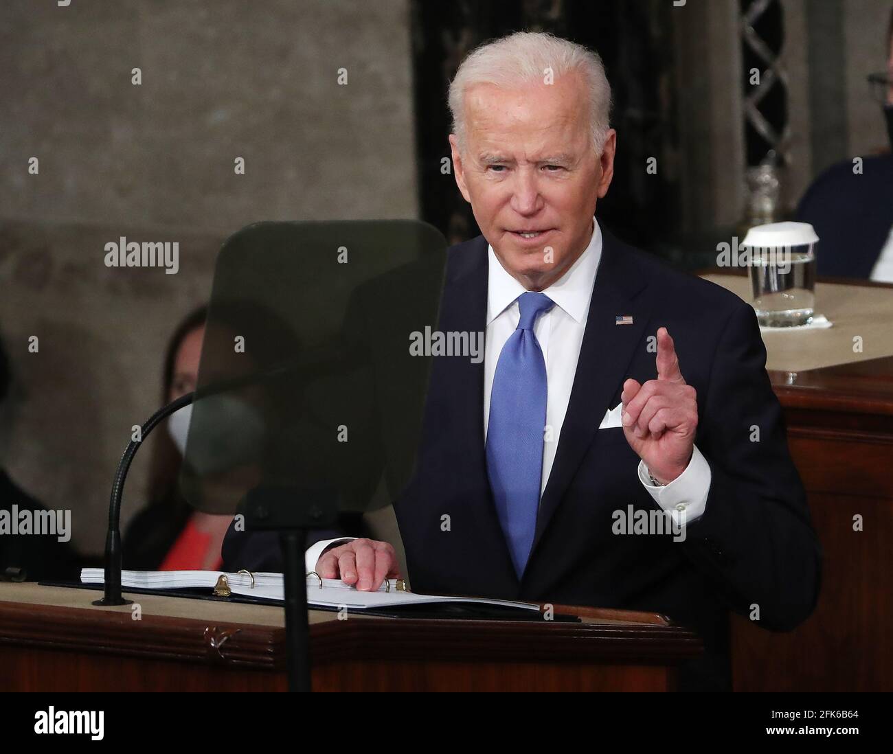 US President Joe Biden delivers his first address to a joint session of ...