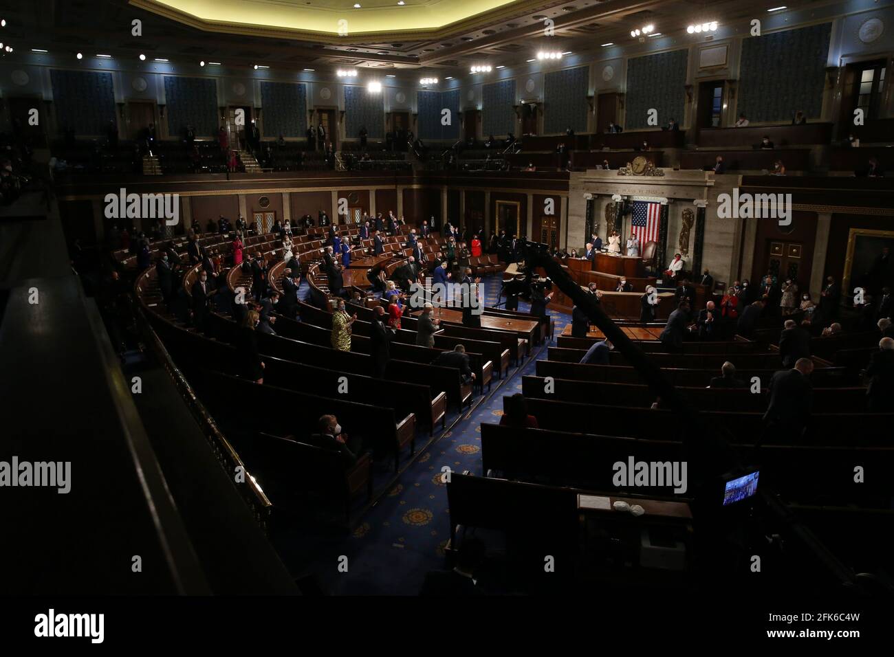 Members of the gallery stand and applaud as US President Joe Biden ...