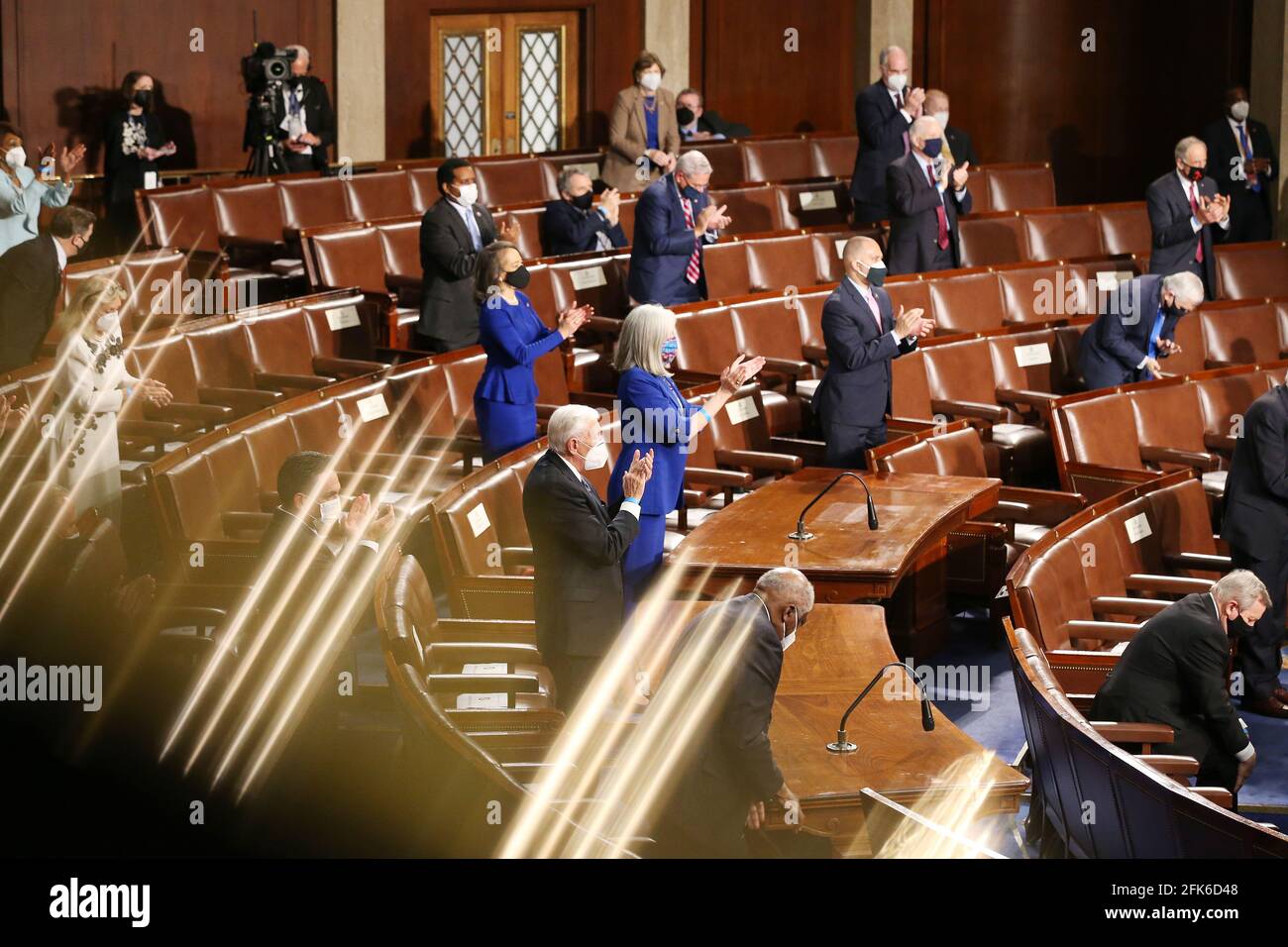 Members of the gallery stand and applaud as US President Joe Biden ...