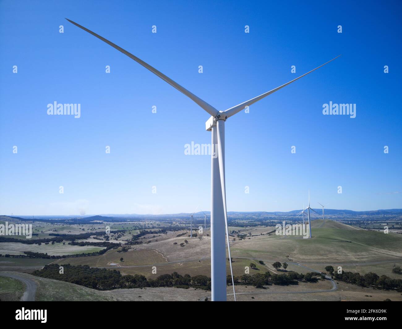 Wind turbine generator with an eco wind farm in the background ...