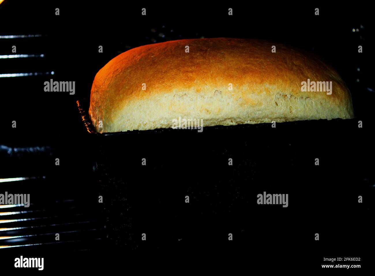 Bread in the oven. Homemade bread is baked in an oven. Baking at home ...