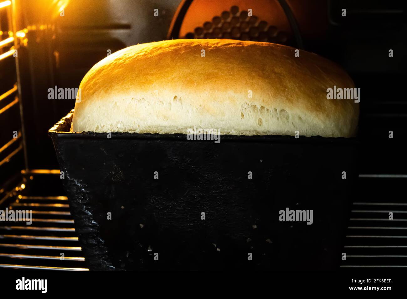 Bread in the oven. Homemade bread is baked in an oven. Baking at home ...