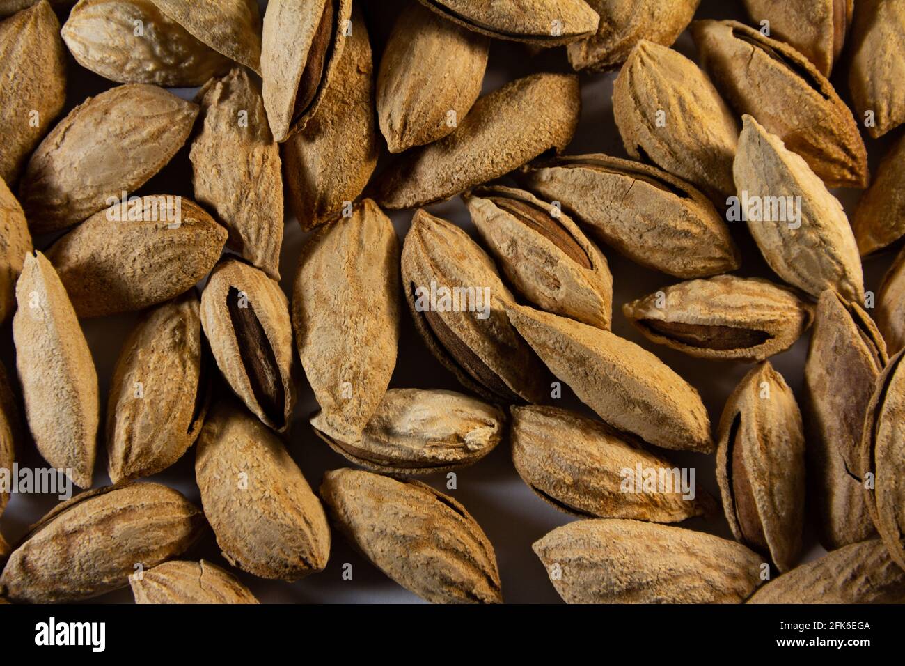 Almond nuts in a shell close-up Stock Photo - Alamy