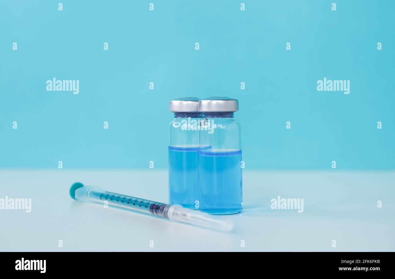 Healthcare and medical concept. Medicine vials and syringe Stock Photo ...