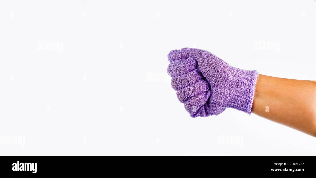 Hand clenched with purple cloth glove - White background Stock Photo ...