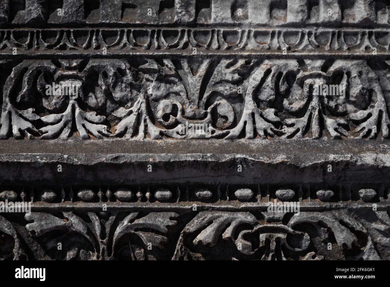 Close-up pattern on antique stone column.Elements of ancient Greek ...